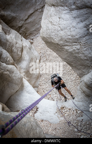 Man descending on a rope into the Barranc de L'Infern, Costa Blanca ...
