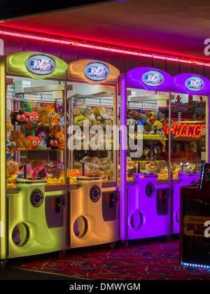interior of amusement arcade with electro mechanical games illuminated ...