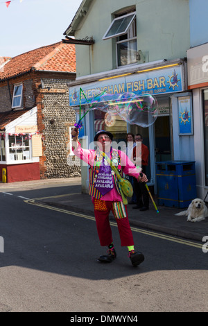 Funny clown blowing bubbles Stock Photo - Alamy
