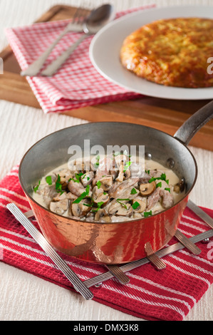 Traditional Swiss zürcher geschnetzeltes with rösti as top view in a ...