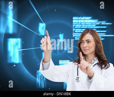 Composite image of doctor pointing at the screen of a computer Stock ...