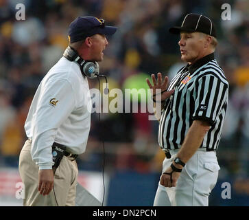 Cal's head coach Jeff Tedford walks off the field after losing to USC ...