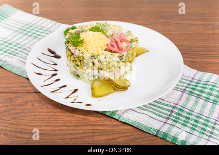 Russian salad with mayonnaise as a ring Stock Photo - Alamy