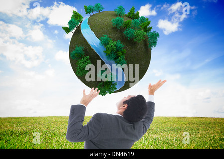 Composite image of businessman with arms raised Stock Photo - Alamy