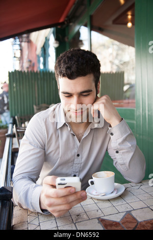 Young hispanic man using photography camera at the city Stock Photo - Alamy