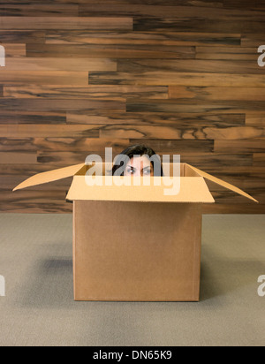Packing Or Unpacking A Small House In Cardboard Box Conceptual View Of