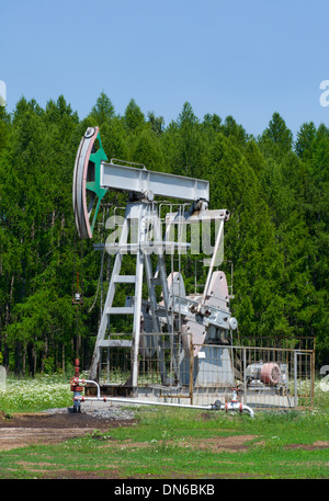oil pump on a background the forest with HDR effect Stock Photo - Alamy