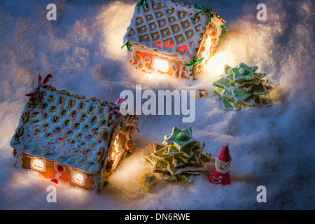 Snowy gingerbread cottage with santa and gifts Stock Photo - Alamy