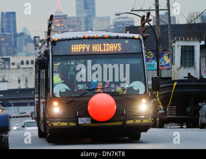 Vancouver, Canada. 19th December 2013. Mr. and Mrs. Claus help ...