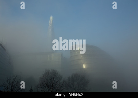 Sunshine through mist reflects through mist off the glass of London's ...