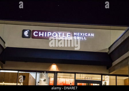 Chipotle Mexican Grill sign at night Stock Photo - Alamy