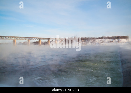 weir and cpr train railway bridge over the south Saskatchewan river ...