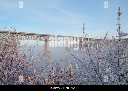 A winter view of the CPR Bridge spanning the South Saskatchewan River ...