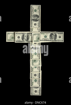 Cross from money Stock Photo - Alamy