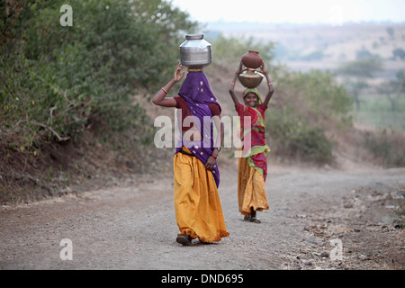 Bhil indigenous woman carrying water jugs on her head Desert survival ...