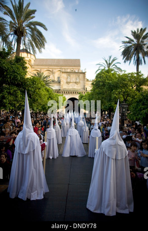 Penitents walk in the Mosque-Cathedral during Easter Holy Week ...