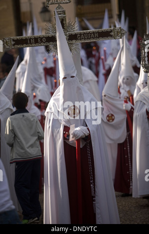 Penitents walk in the Mosque-Cathedral during Easter Holy Week ...