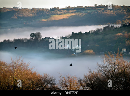 Misty morning in the Stroud Valley, Gloucestershire with St Mary ...