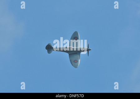 Spitfire in WWII blue photo reconnaissance camouflage against blue sky ...