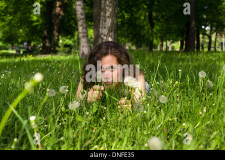 Woman having rest on meadow Stock Photo - Alamy