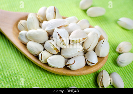 Spoon full of Pistachio Nuts Stock Photo - Alamy