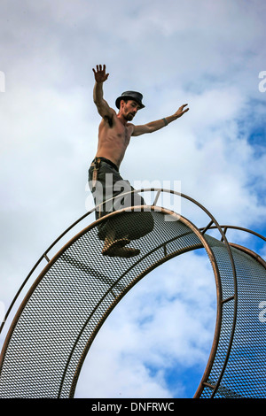 Circus performer entertaining the public with his hamster wheel Stock ...
