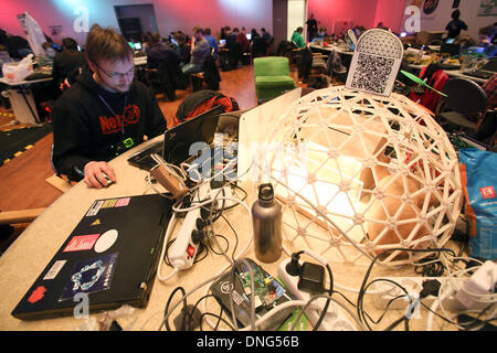 Hamburg, Germany. 27th Dec, 2013. Participants sit during the 30th ...