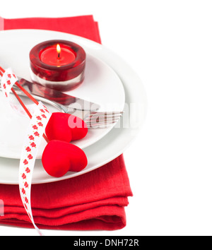 Valentines day table setting with plate, fork, knife, ring, ribbon and ...