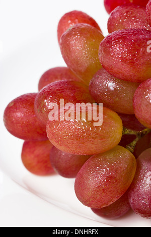 Bunch of red grapes , fresh with water drops. Isolated on white ...