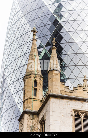The Gherkin reflecting St Andrew Undershaft church, St Mary Axe and ...