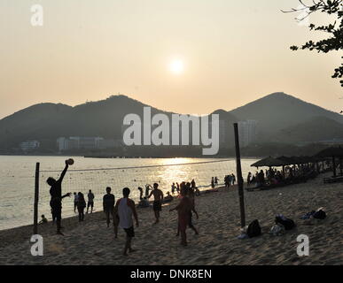 Tourists play at the seaside in Sanya City, southernmost China's Hainan ...