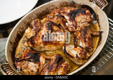 Chicken cooked inside the pan Stock Photo - Alamy