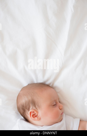 Cute sleeping girl in white bed Stock Photo - Alamy