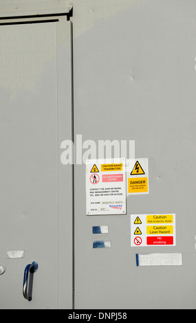 Safety and warning signs attached to a metal distribution box Stock ...