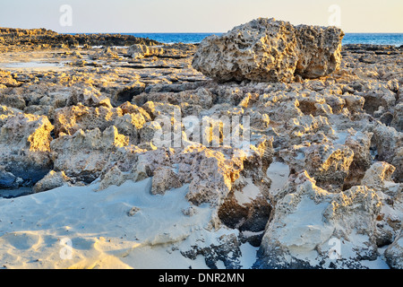 sun shines on rock formation with shadows and texture Stock Photo - Alamy