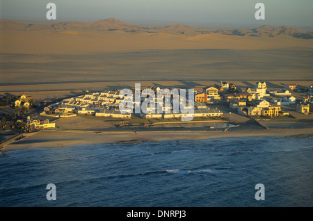 Aerial view of Dolfynstrand resort on Atlantic coast and Namib desert ...