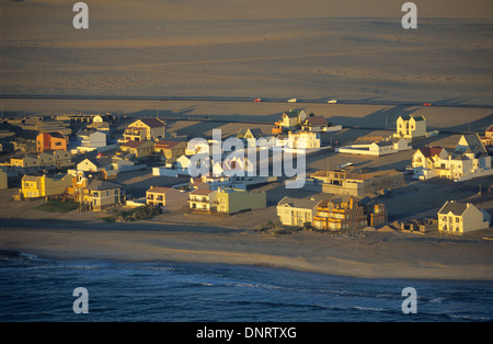 Aerial view of Dolfynstrand resort on Atlantic coast and Namib desert ...