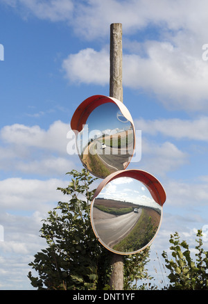 Convex Observation Mirror on Blind Bend in Road Stock Photo - Alamy