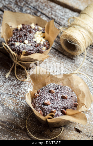 Closeup of decorating chocolate muffins with string Stock Photo - Alamy