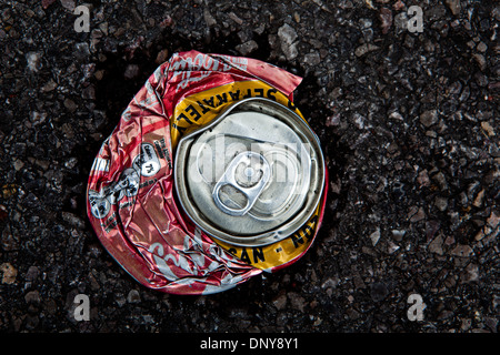 Squashed flat aluminium Coca Cola Coke beverage tin can in road Stock ...