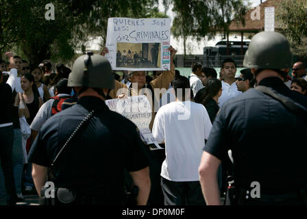 Mar 27, 2006; Escondido, CA, USA; Police personnel take a student into ...