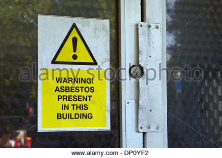 Asbestos warning signs for health and safety on a construction site ...