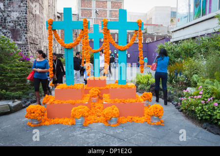 Violet wall, crucifix and flower tagetes erecta or cempasuchil use for ...