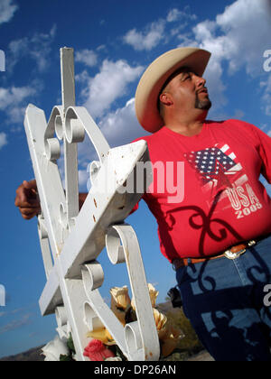 May 18, 2006; Redford, TX, USA; Margarito Hernandez tends the flowers ...