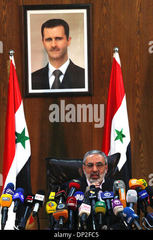 Syrian Information Minister Omran al-Zoubi speaks to the press before a ...