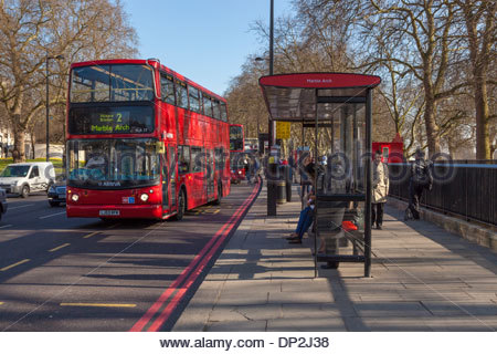 People and London buses on a Busy night in Piccadilly Circus Central ...