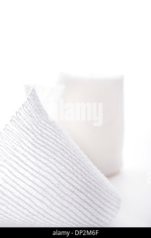 White, rolled up gauze bandage and cotton wool Stock Photo - Alamy
