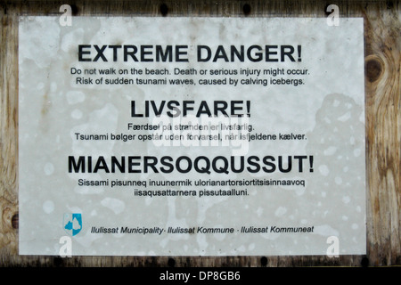 Warning sign in Greenlandic, Danish, and English Stock Photo - Alamy