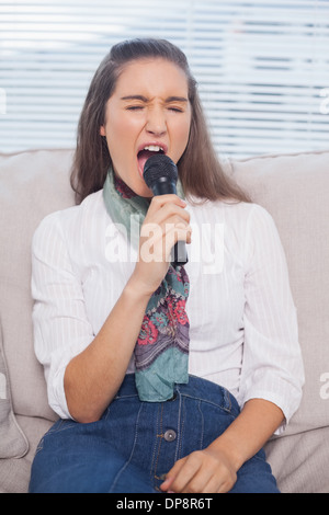 Girl singing karaoke Stock Photo - Alamy