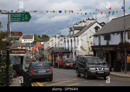 Ireland, Co Donegal, Dungloe village, shops and bars in main street ...